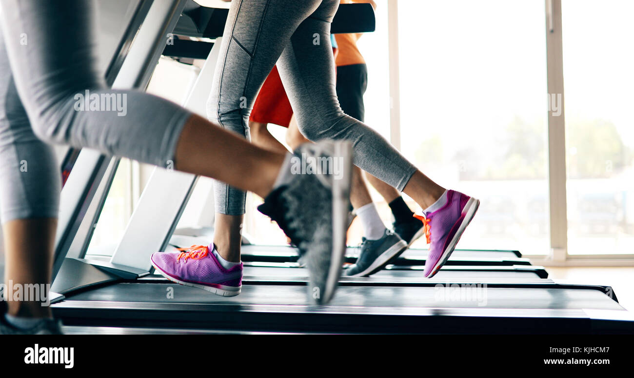 Picture of people running on treadmill in gym Stock Photo - Alamy