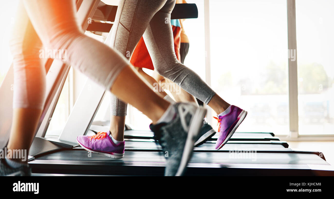 Picture of people running on treadmill in gym Stock Photo - Alamy