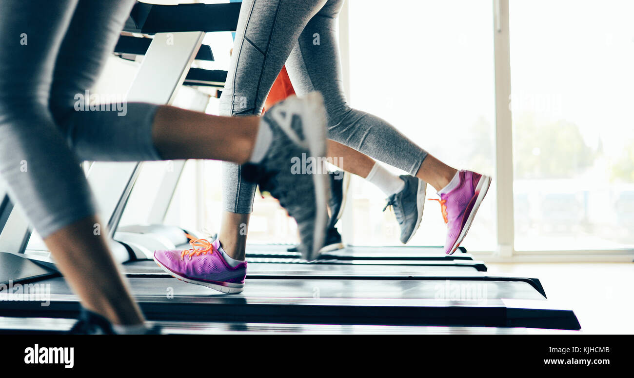 Picture of people running on treadmill in gym Stock Photo - Alamy