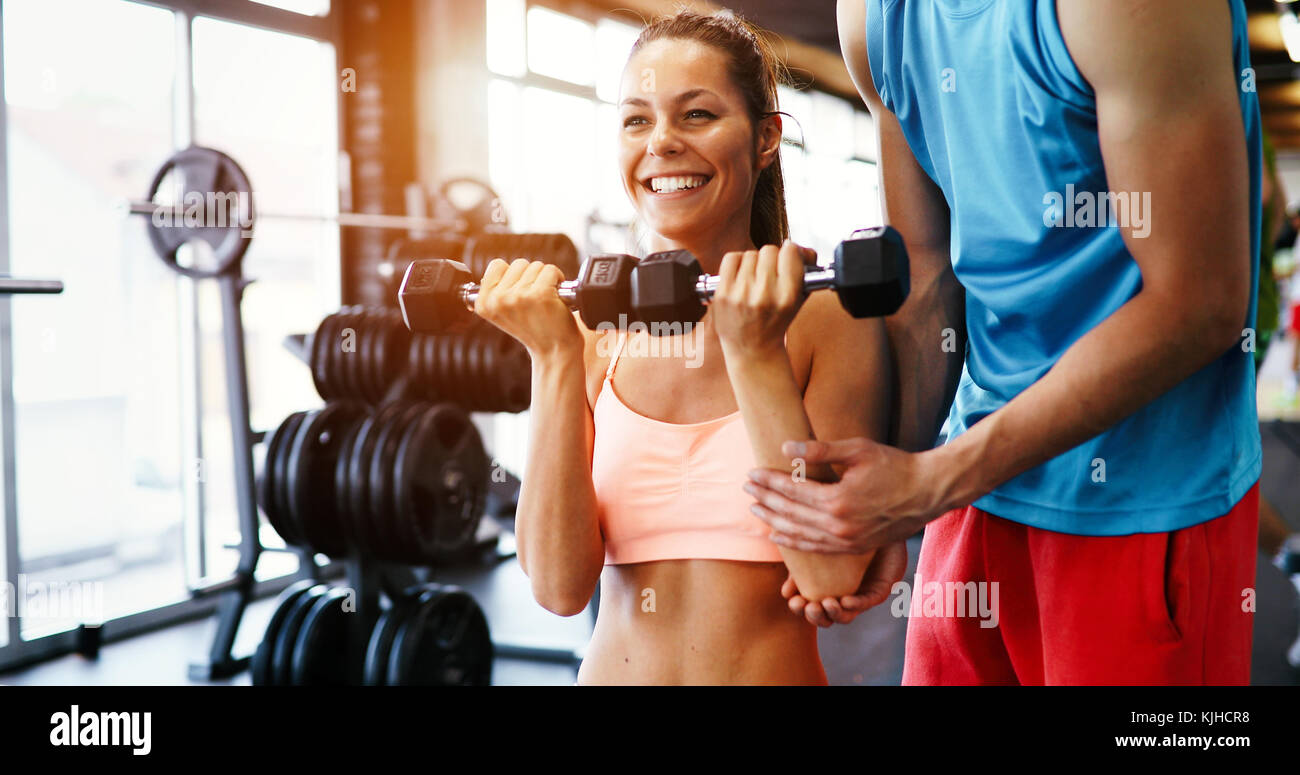 Beautiful woman exercising in gym Stock Photo - Alamy