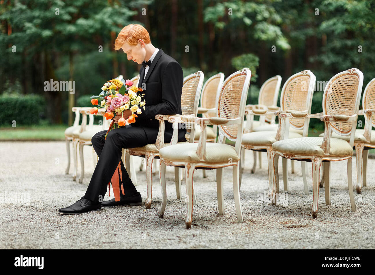 The bride is waiting for the bride with flowers Stock Photo - Alamy