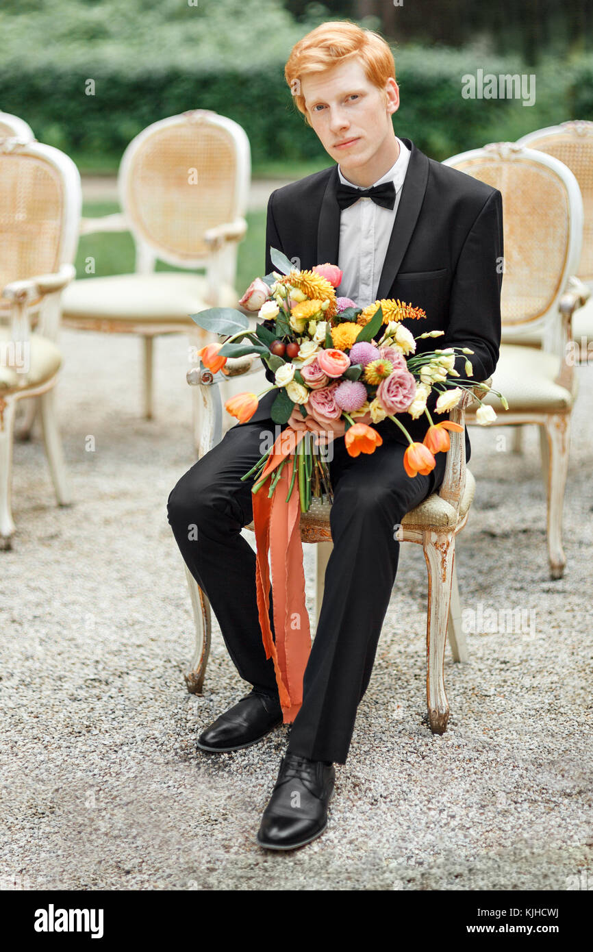 The bride is waiting for the bride with flowers Stock Photo - Alamy