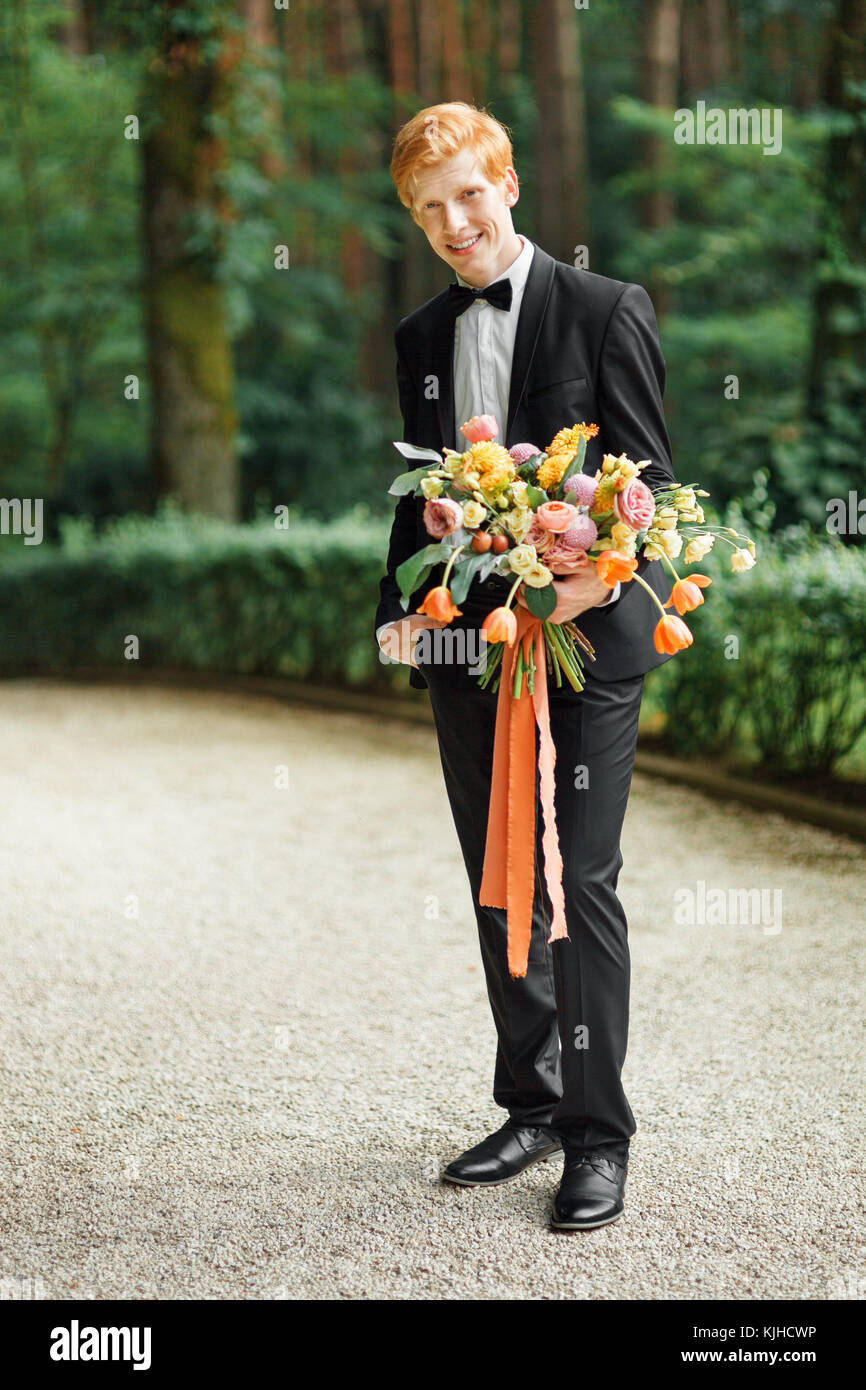 The bride is waiting for the bride with flowers Stock Photo - Alamy
