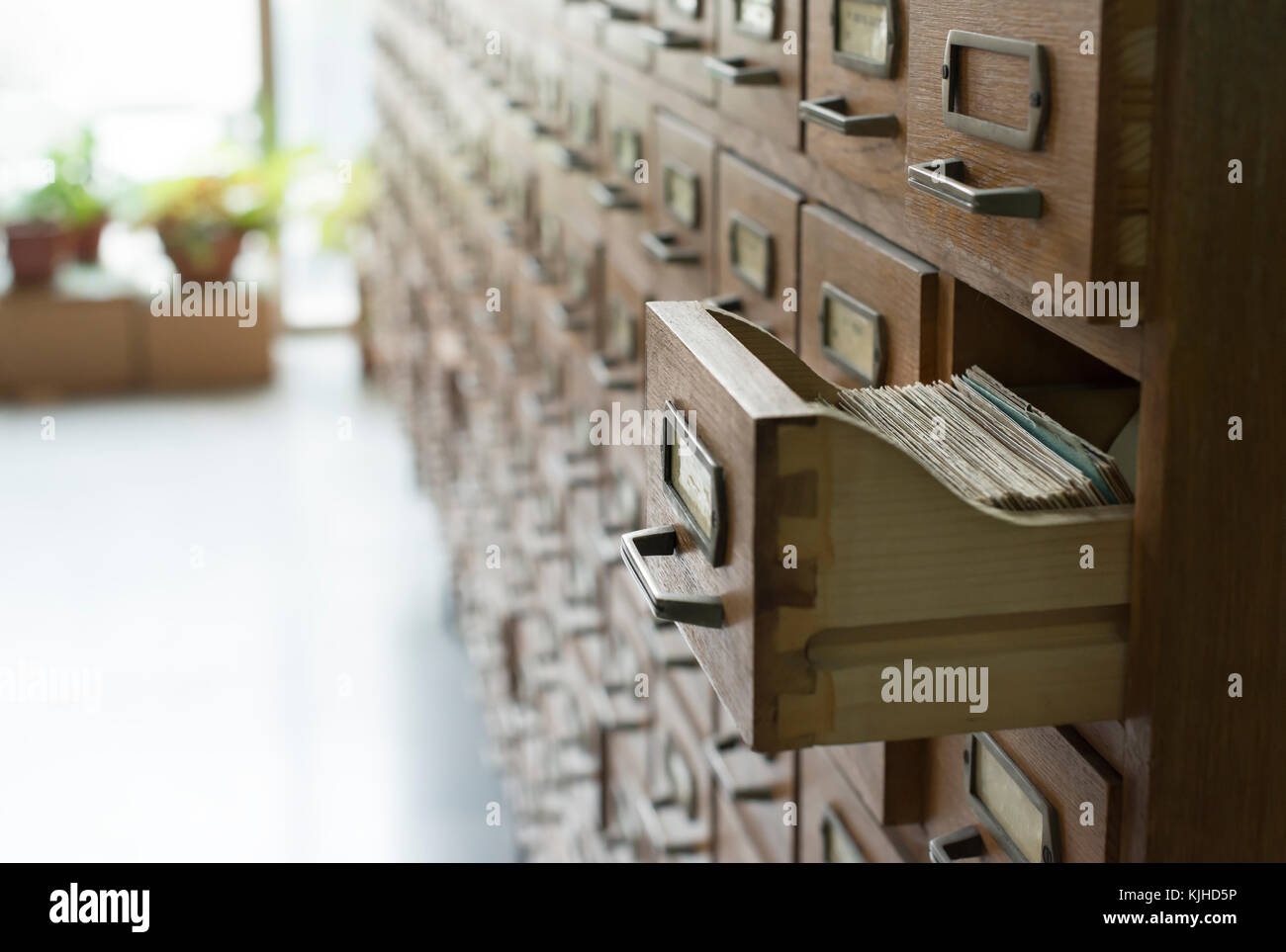Old opened wooden drawers in archive Stock Photo - Alamy