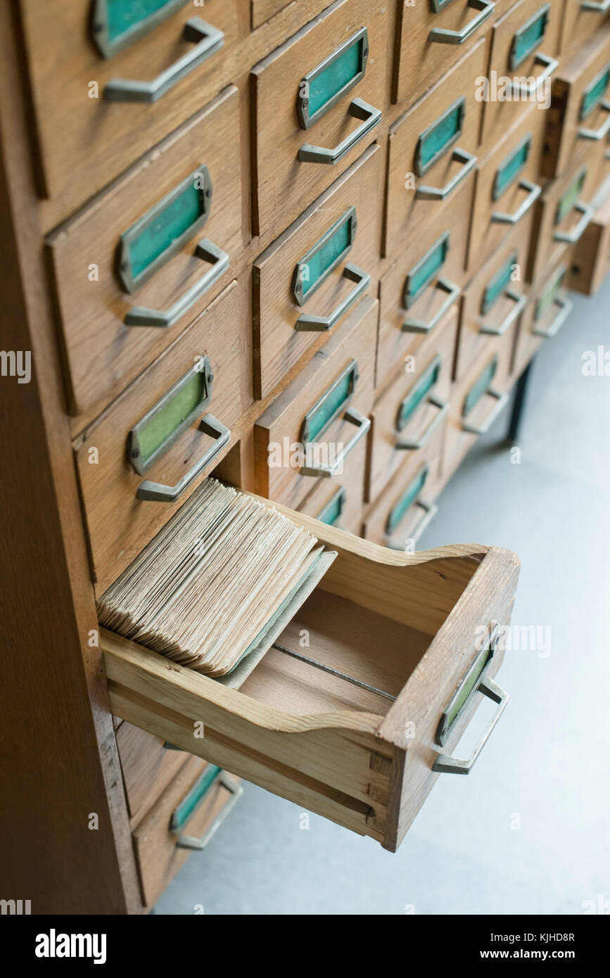 Old opened wooden drawers in archive Stock Photo - Alamy