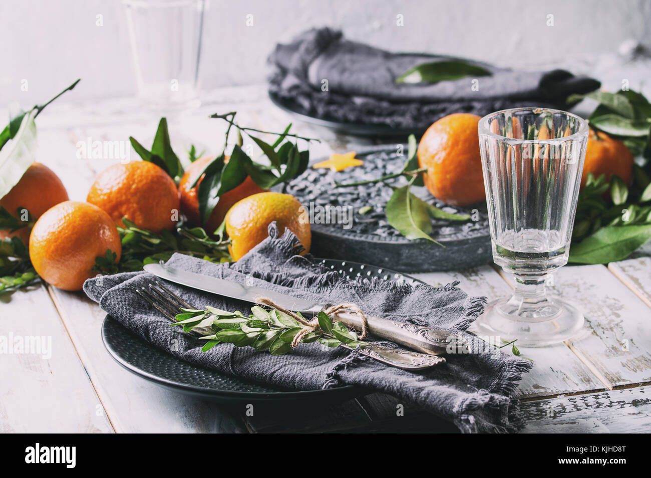 Christmas table decorations with clementines Stock Photo - Alamy