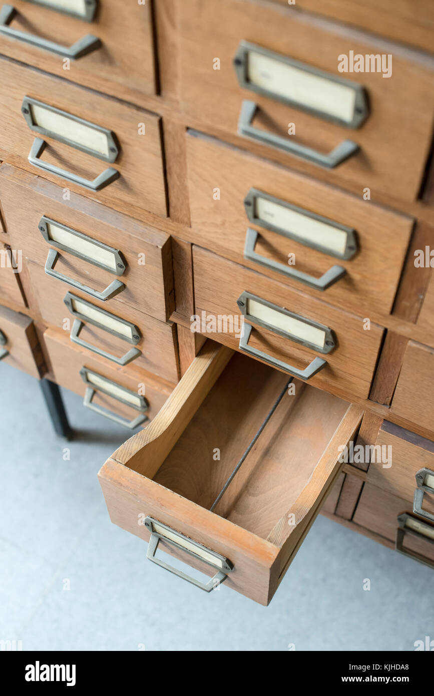 Old opened wooden drawers in archive Stock Photo - Alamy