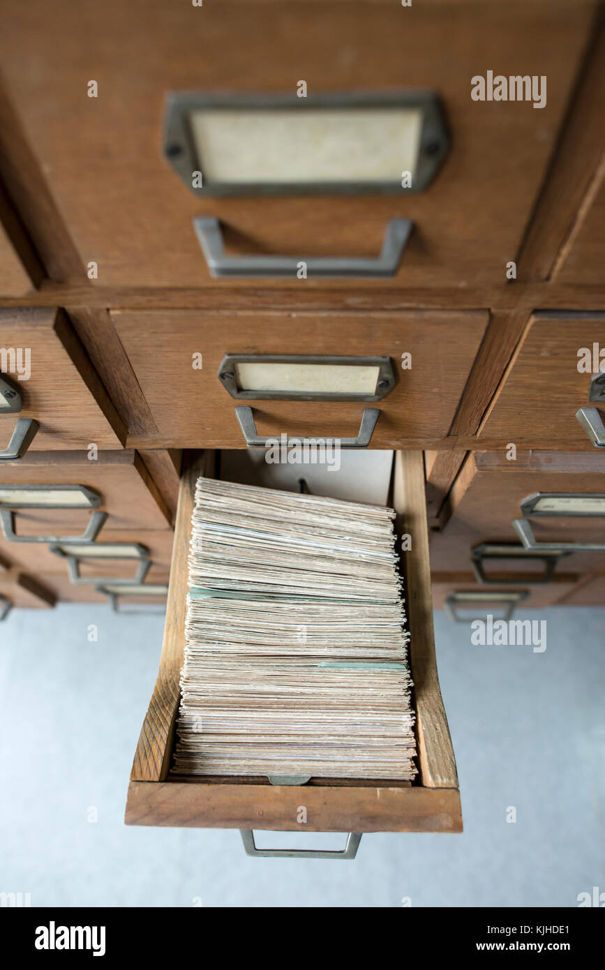 Old opened wooden drawers in archive Stock Photo - Alamy