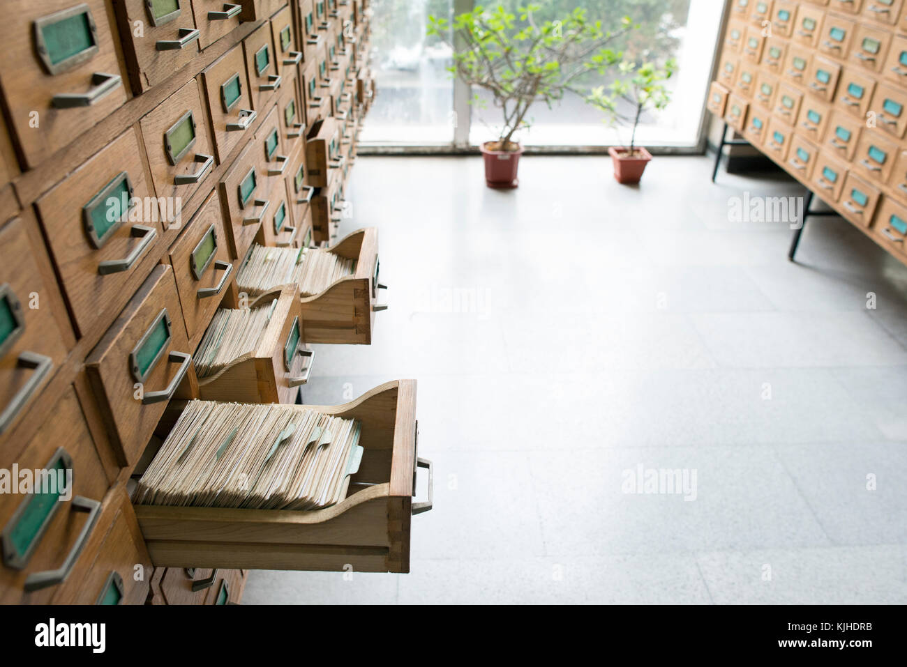 Old opened wooden drawers in archive Stock Photo - Alamy