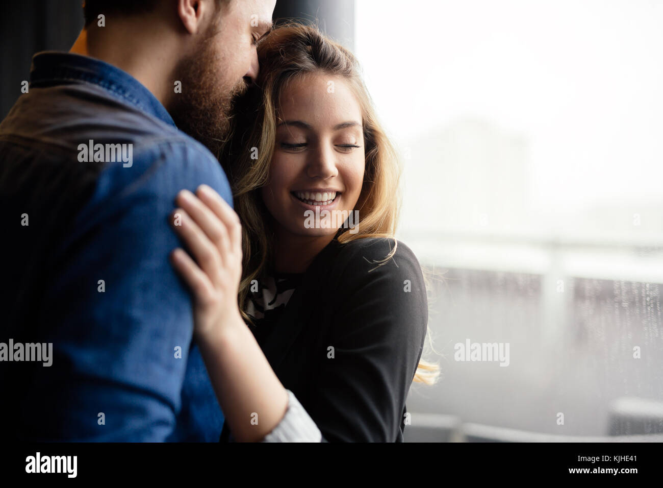 Happy couple hugging and sharing emotions Stock Photo - Alamy