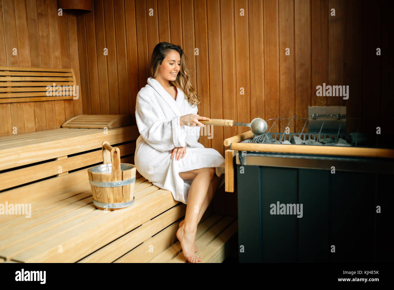 Beautiful woman resting in sauna Stock Photo - Alamy