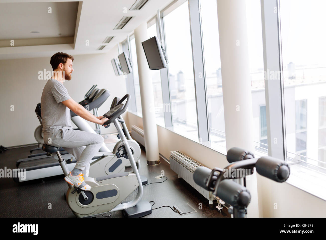 Man cardio training on a bicycle Stock Photo - Alamy