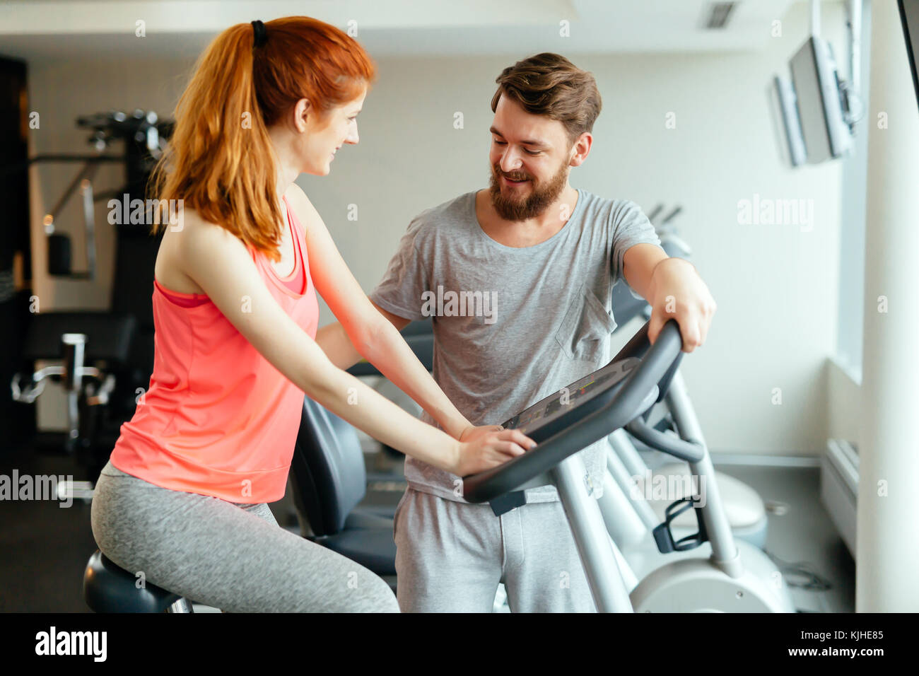 Personal trainer giving instructions Stock Photo - Alamy