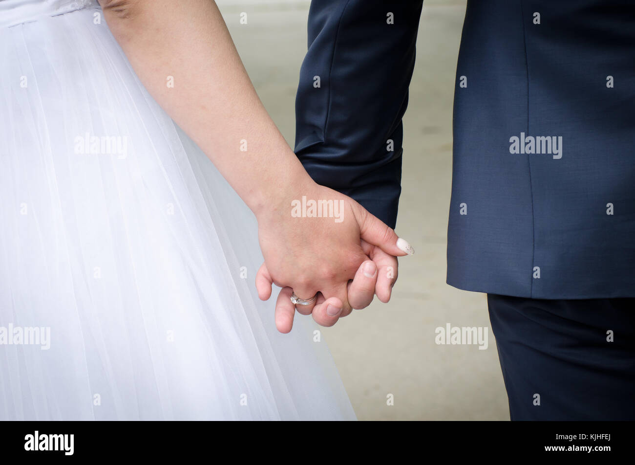 bride and groom holding hands at the wedding Stock Photo - Alamy
