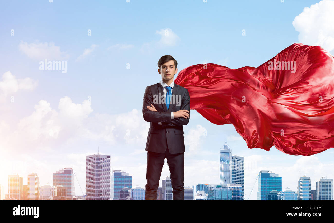 Concept of power and sucess with businessman superhero in big city ...