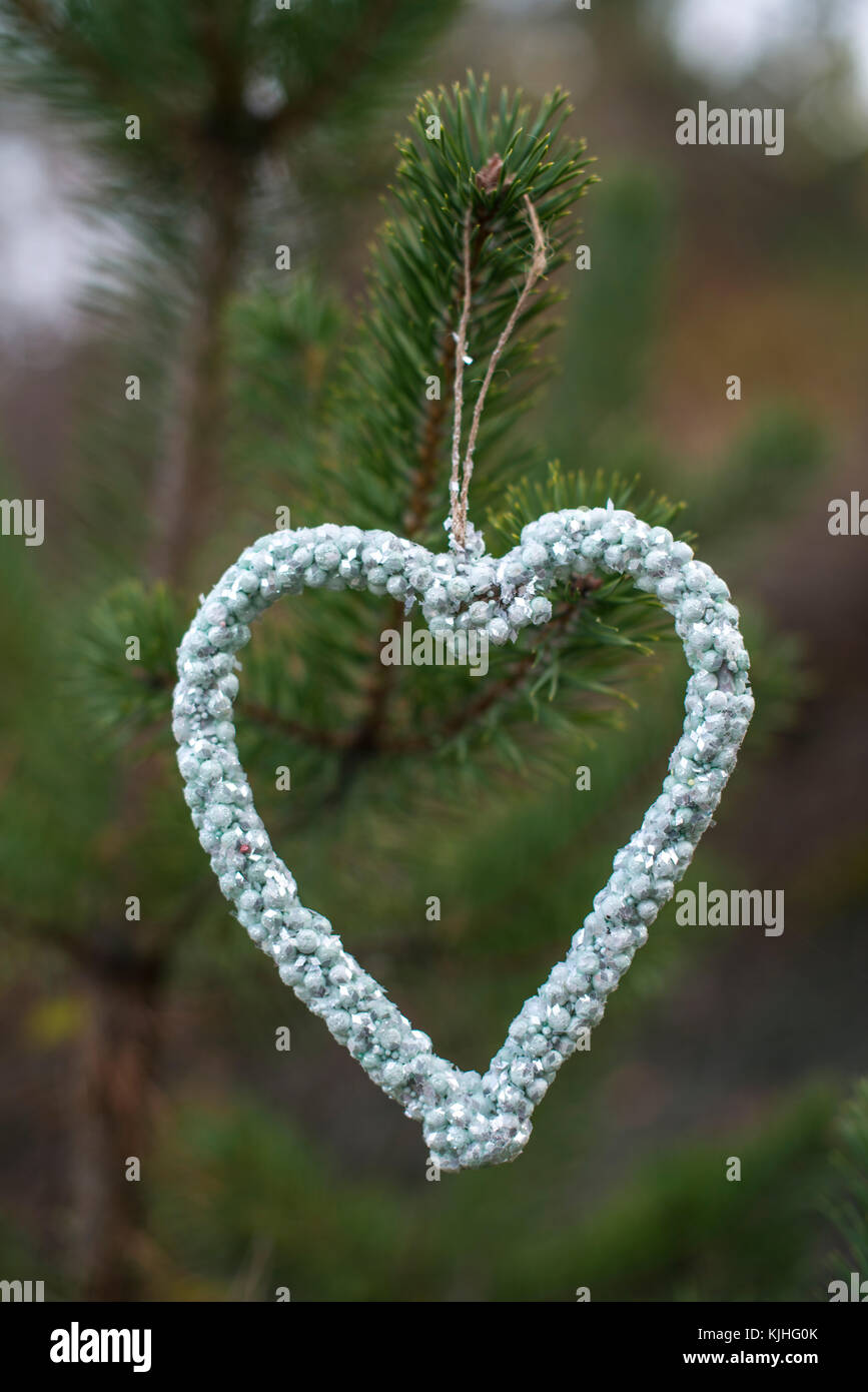 Heart shape on tree. Heart of crystals on branch Stock Photo - Alamy