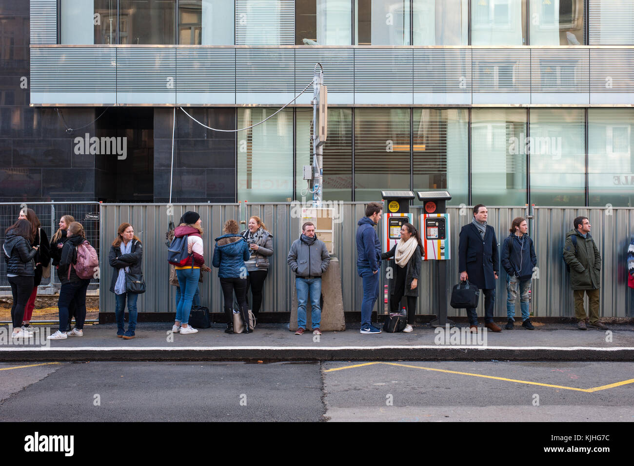 People waiting for a bus at a bus stop, Luxembourg City Stock Photo - Alamy