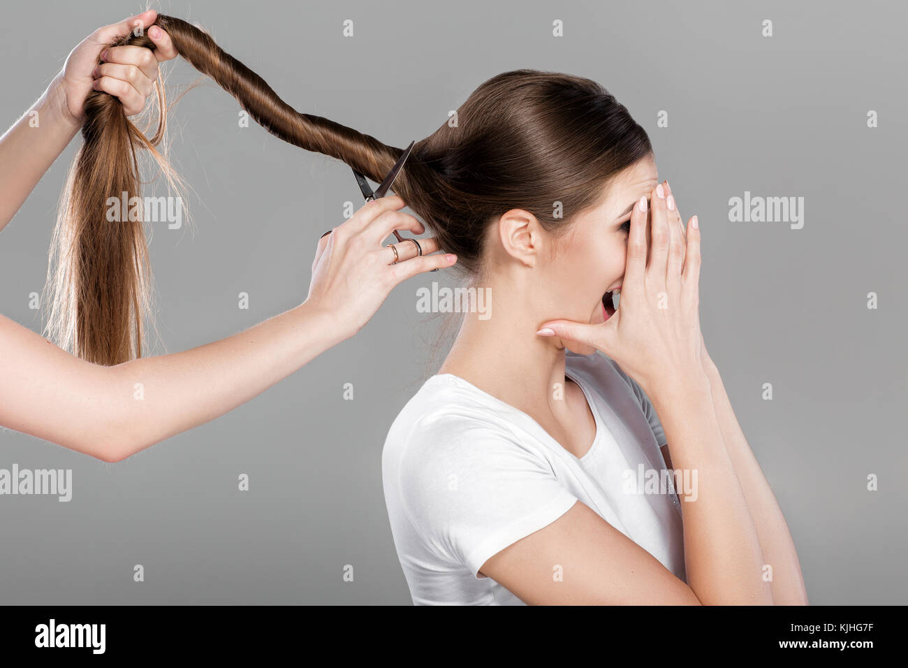 woman with long hair holds scissors Stock Photo - Alamy