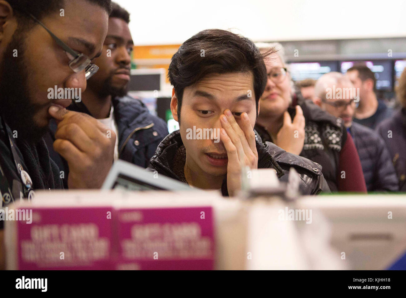 Shoppers purchase gaming merchandise in games retailer GAME in ...