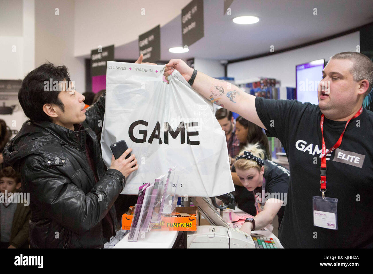Shoppers purchase gaming merchandise in games retailer GAME in ...