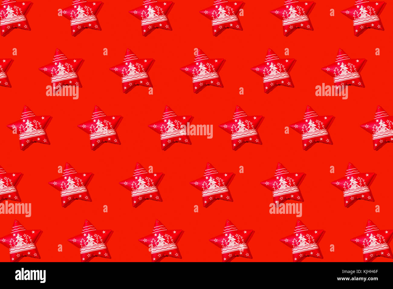 Christmas red star repeated pattern background Stock Photo - Alamy