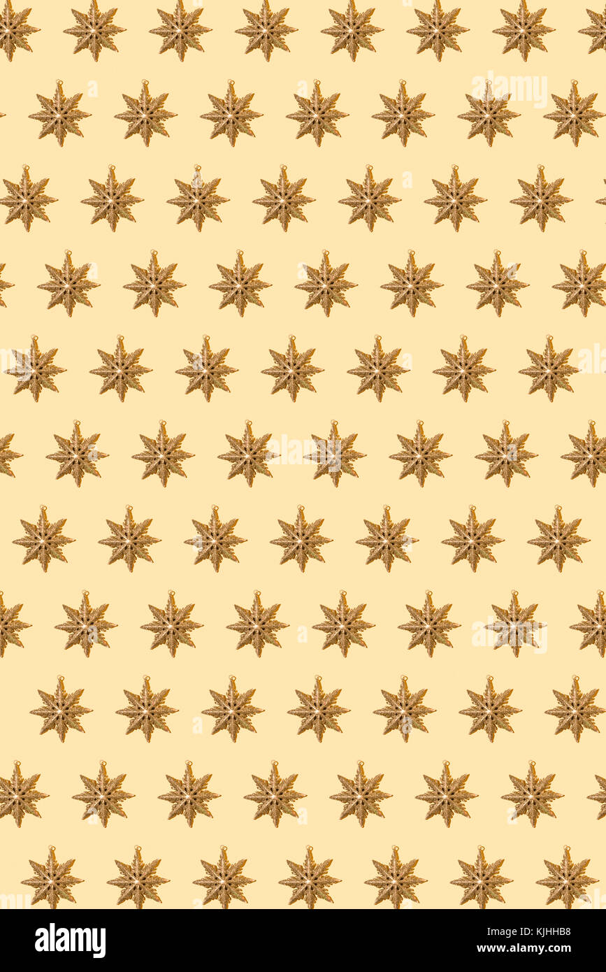 Snowflakes repeated on yellow background pattern Stock Photo - Alamy