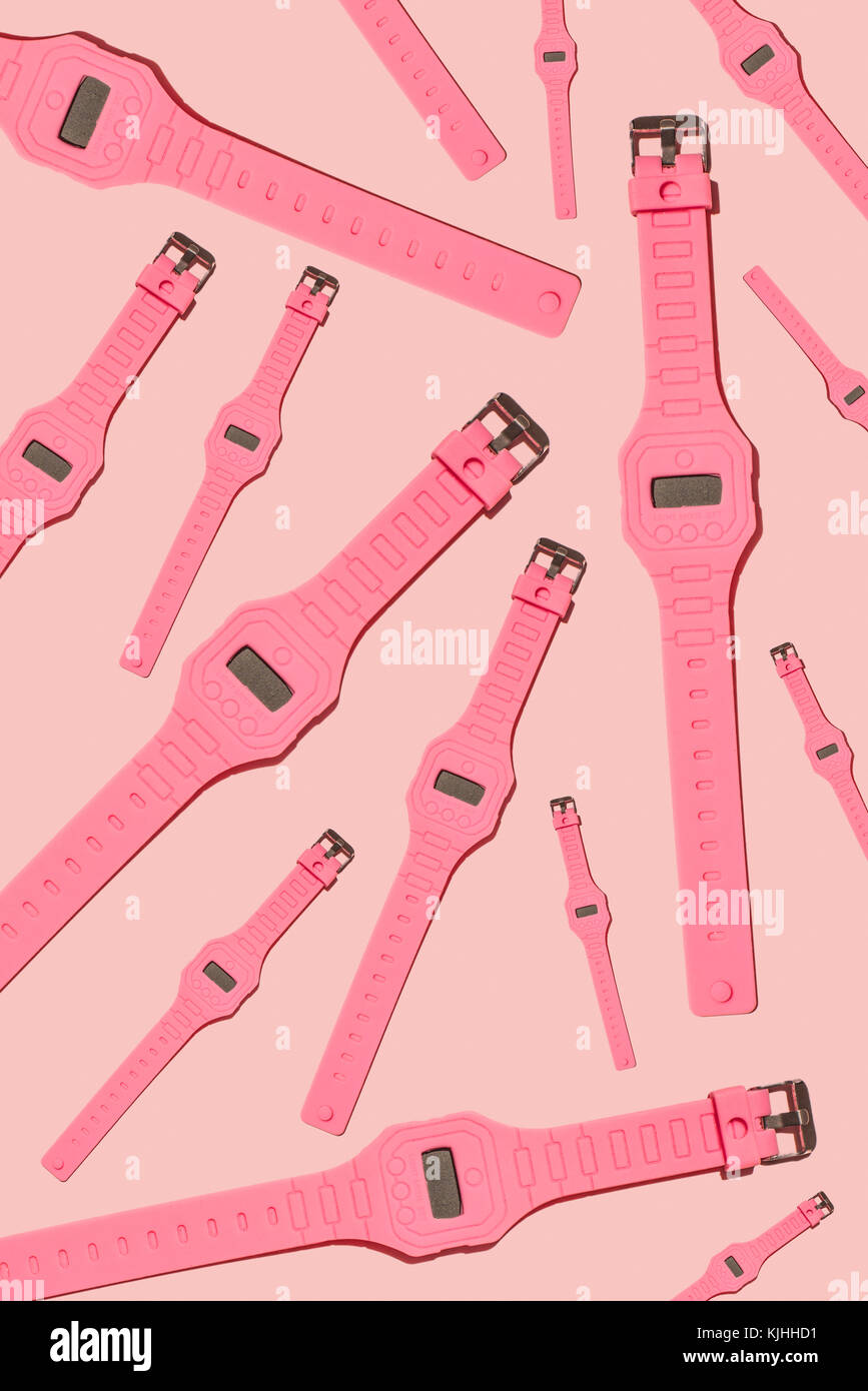 Bright colour hand pink clock pattern on pink background Stock Photo ...