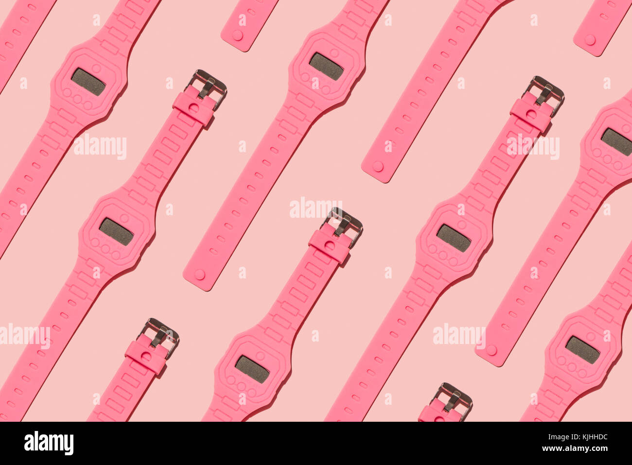 Bright colour hand pink clock pattern on pink background Stock Photo ...