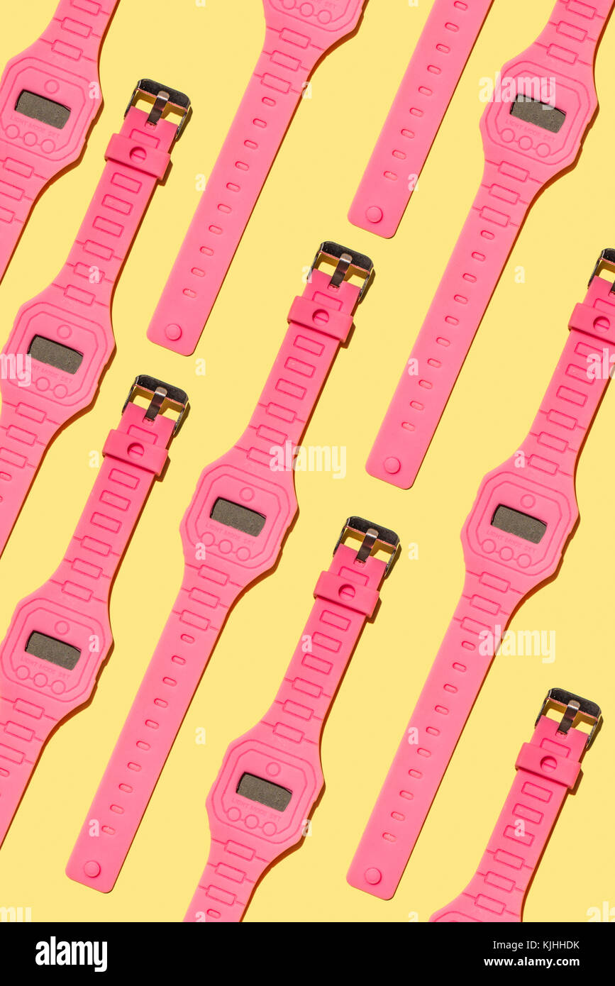 Bright colour hand pink clock pattern on yellow background Stock Photo ...