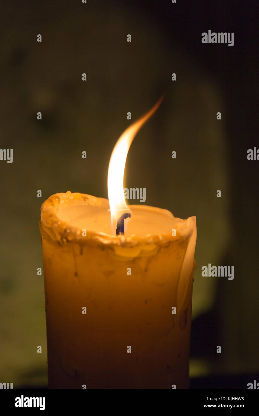 old candle lit in shade Stock Photo - Alamy