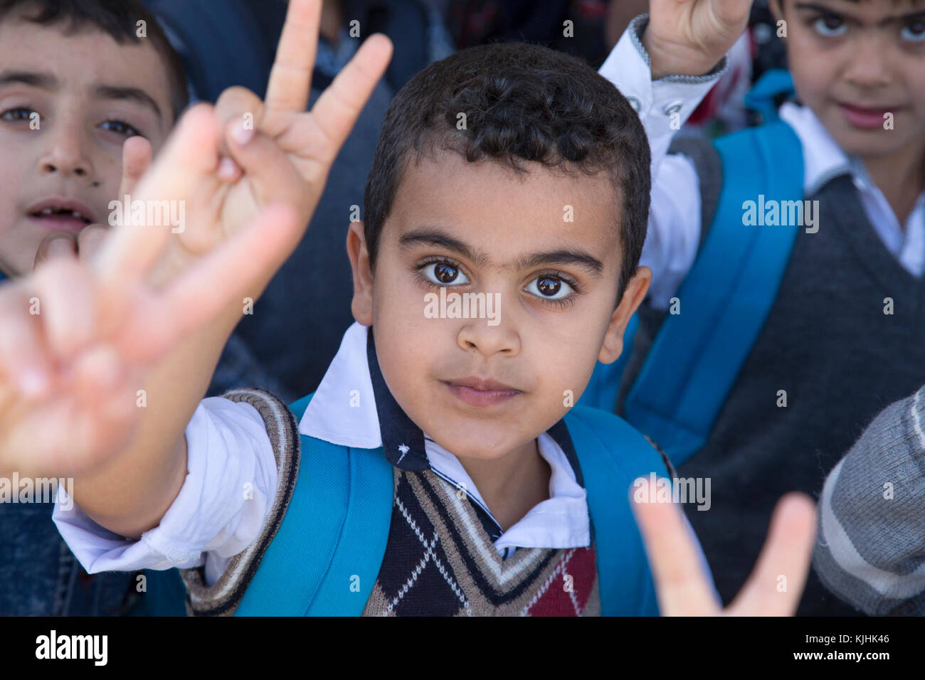 Iraqi students pose for a photo at a primary school, Mosul Dam Village ...