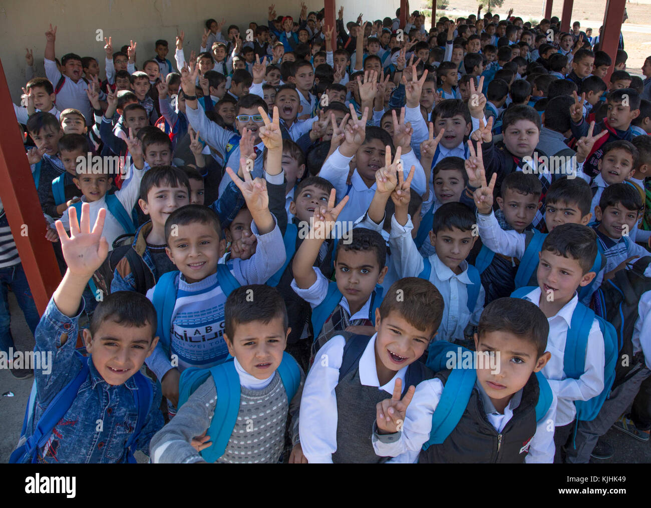 Iraqi students pose for a photo at a primary school, Mosul Dam Village ...