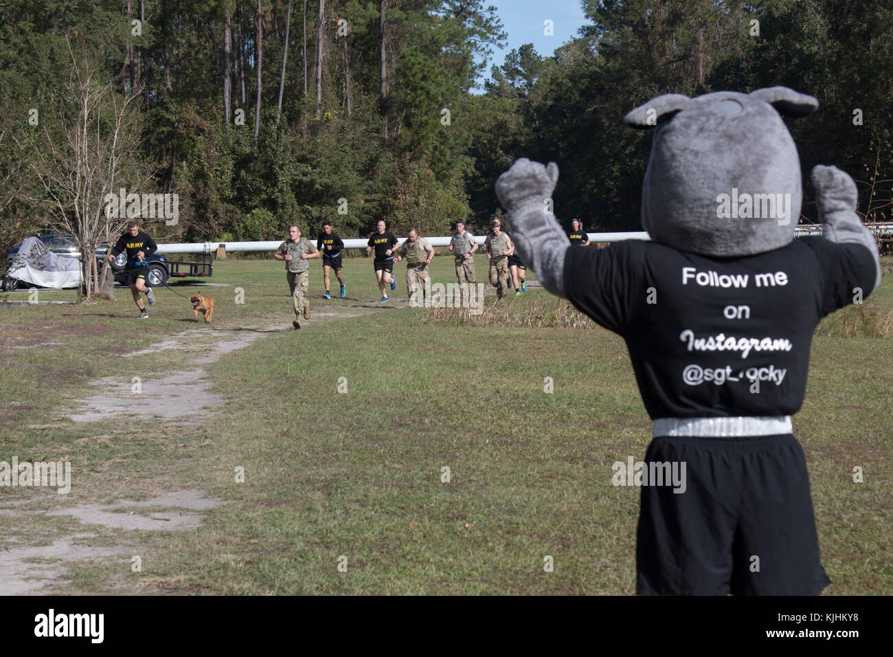Sgt. Rocky, 3rd Infantry Division's mascot, cheers on a team from 2nd ...