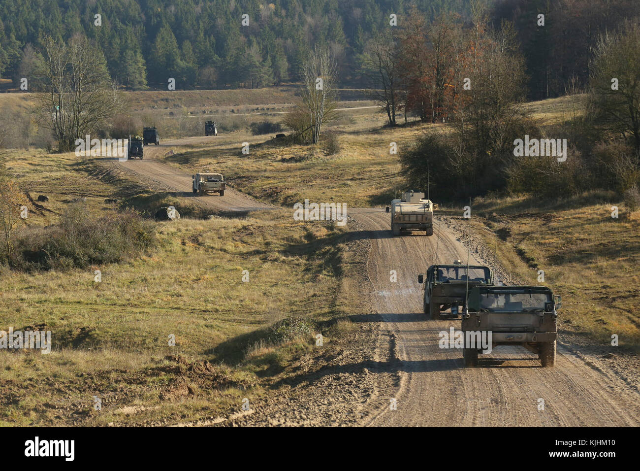 A convoy of U.S. Humvees and Lithuanian Land Rover Lightweight Military ...