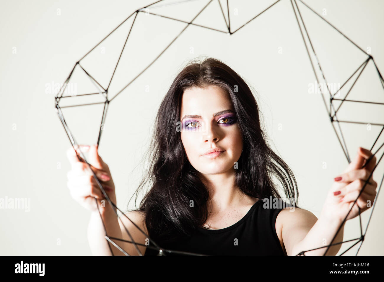 Fashion girl is posing with art geometry object Stock Photo - Alamy