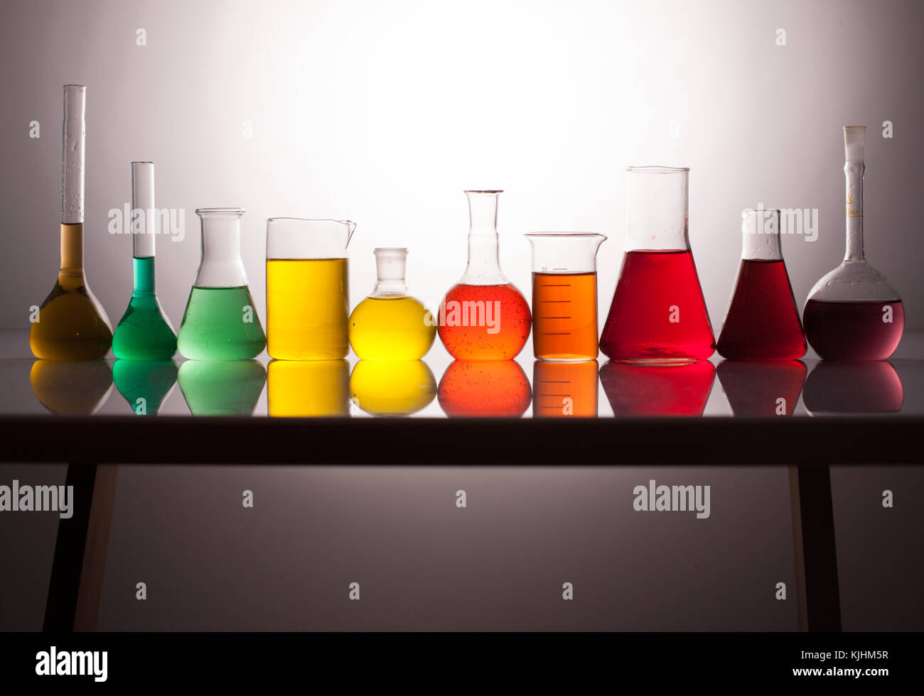 Laboratory glass with rainbow color liquids, chemistry still life Stock ...