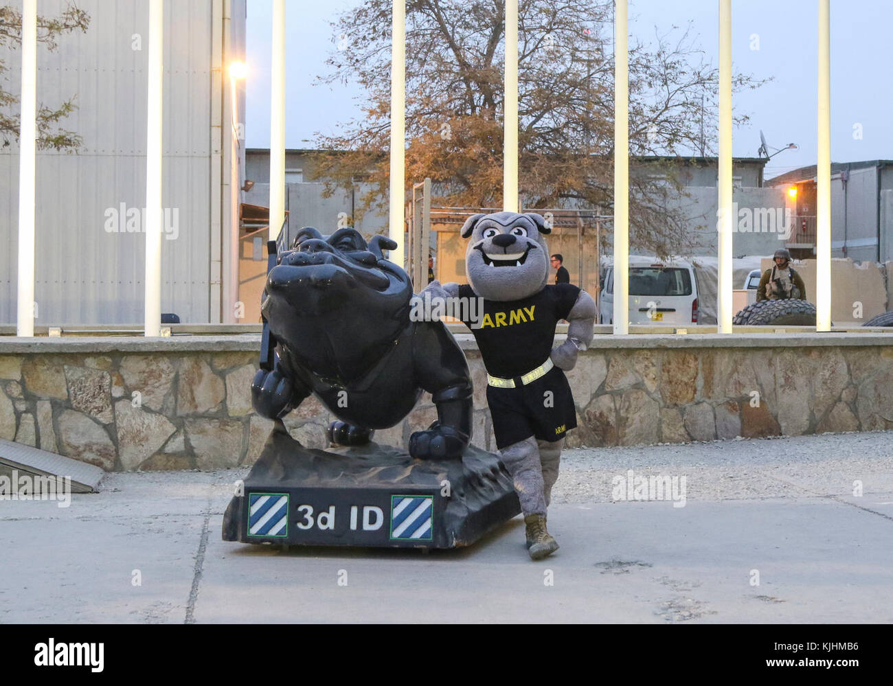 Rocky, the 3rd Infantry Division mascot, poses with a statue of himself ...