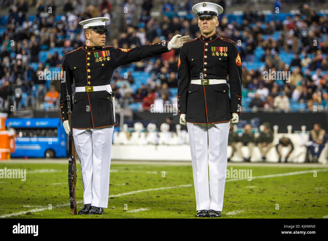 Sergeant Christopher Weddington, drill master, dusts off the shoulder ...