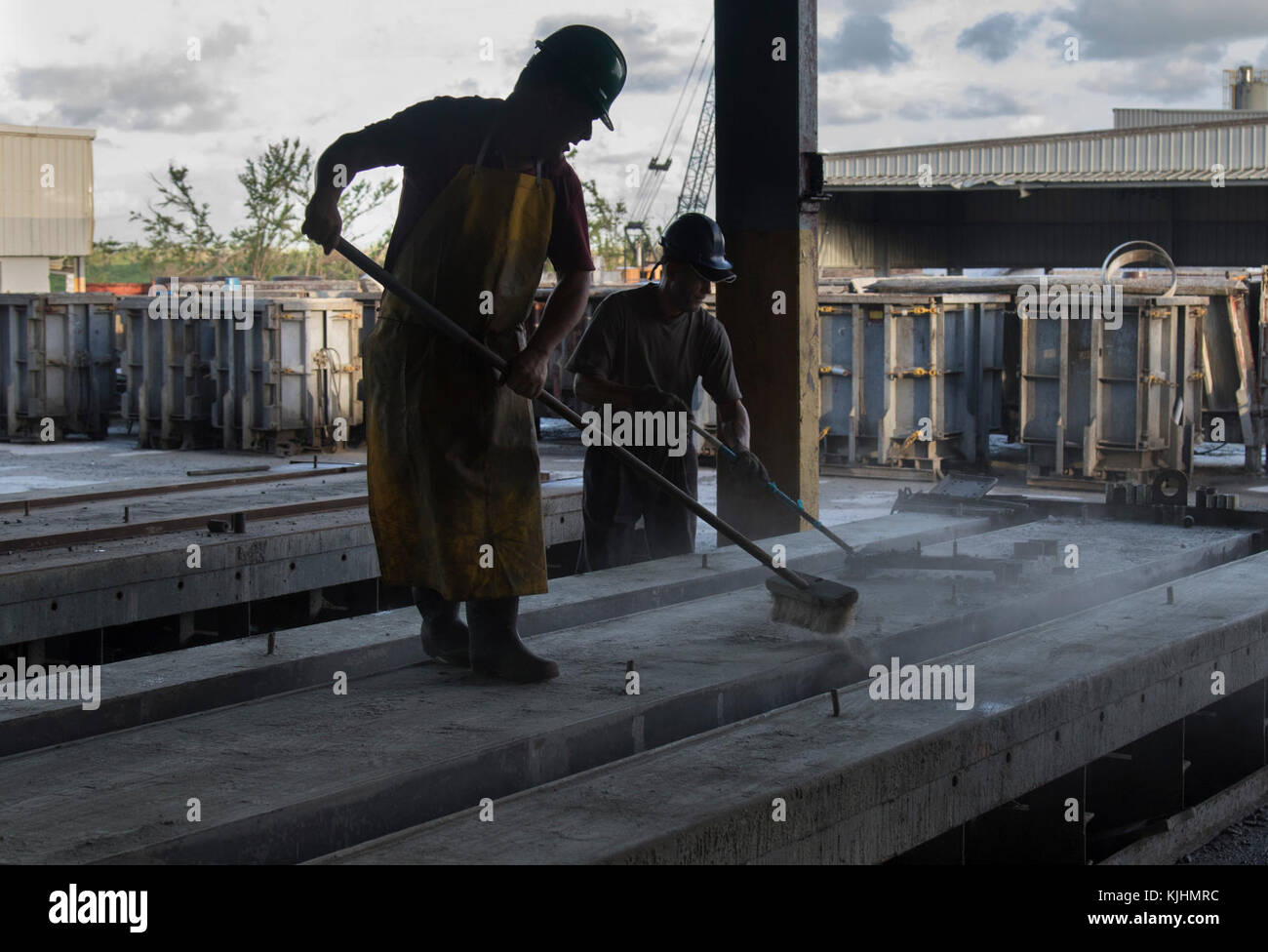 SAN JUAN, Puerto Rico – Workers at Power Precast Corp. clean up a ...