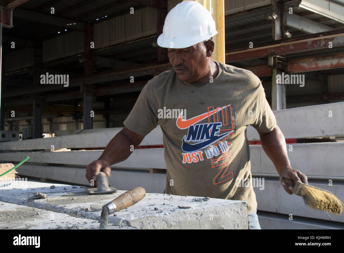 SAN JUAN, Puerto Rico – A worker puts the finishing touches on a ...