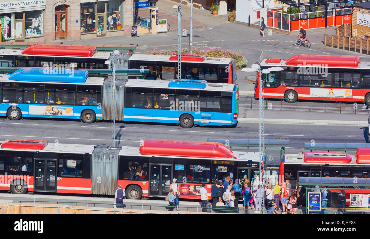Passengers commuters catching buses, Slussen, Sodermalm, Stockholm ...