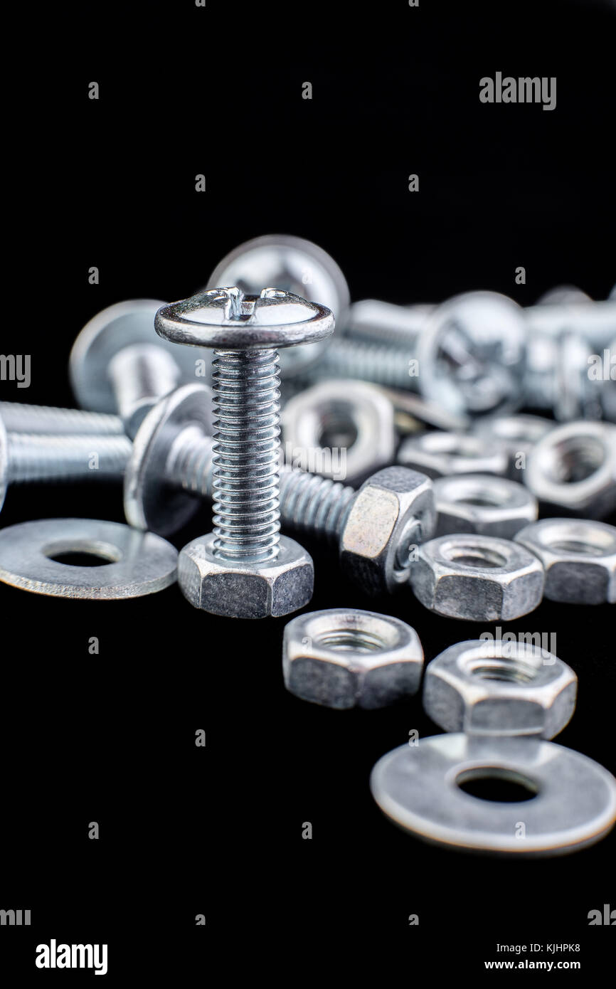 Metal nuts and bolts background. Macro. Working tools. Fixing elements Stock Photo - Alamy