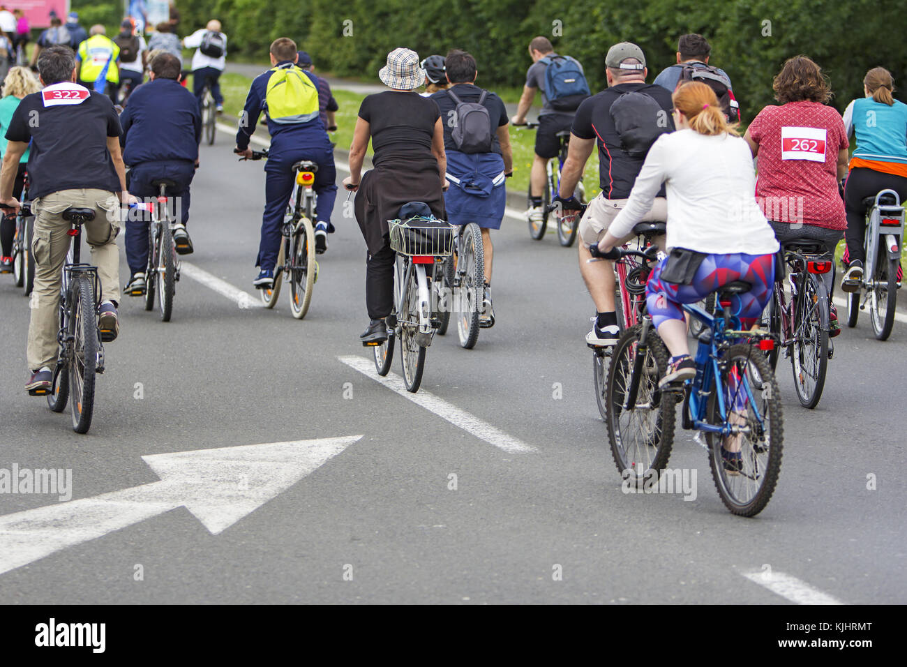 Bicyclists in traffic public transport in the city Stock Photo - Alamy