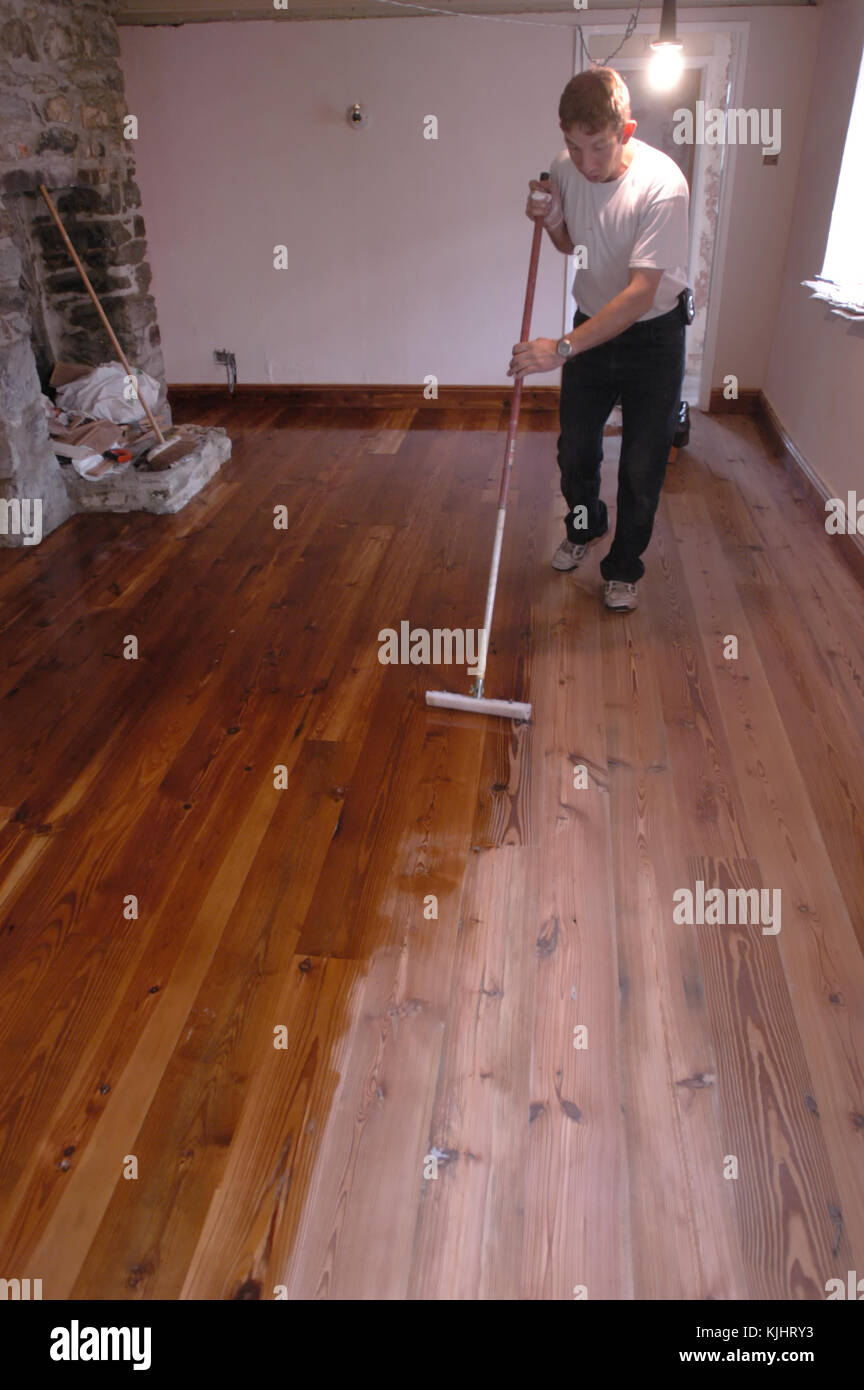 A carpenter working on a newly-laid floor Stock Photo - Alamy