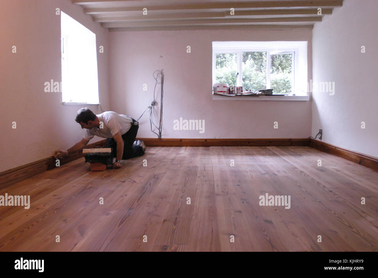 A carpenter working on a newly-laid floor Stock Photo - Alamy