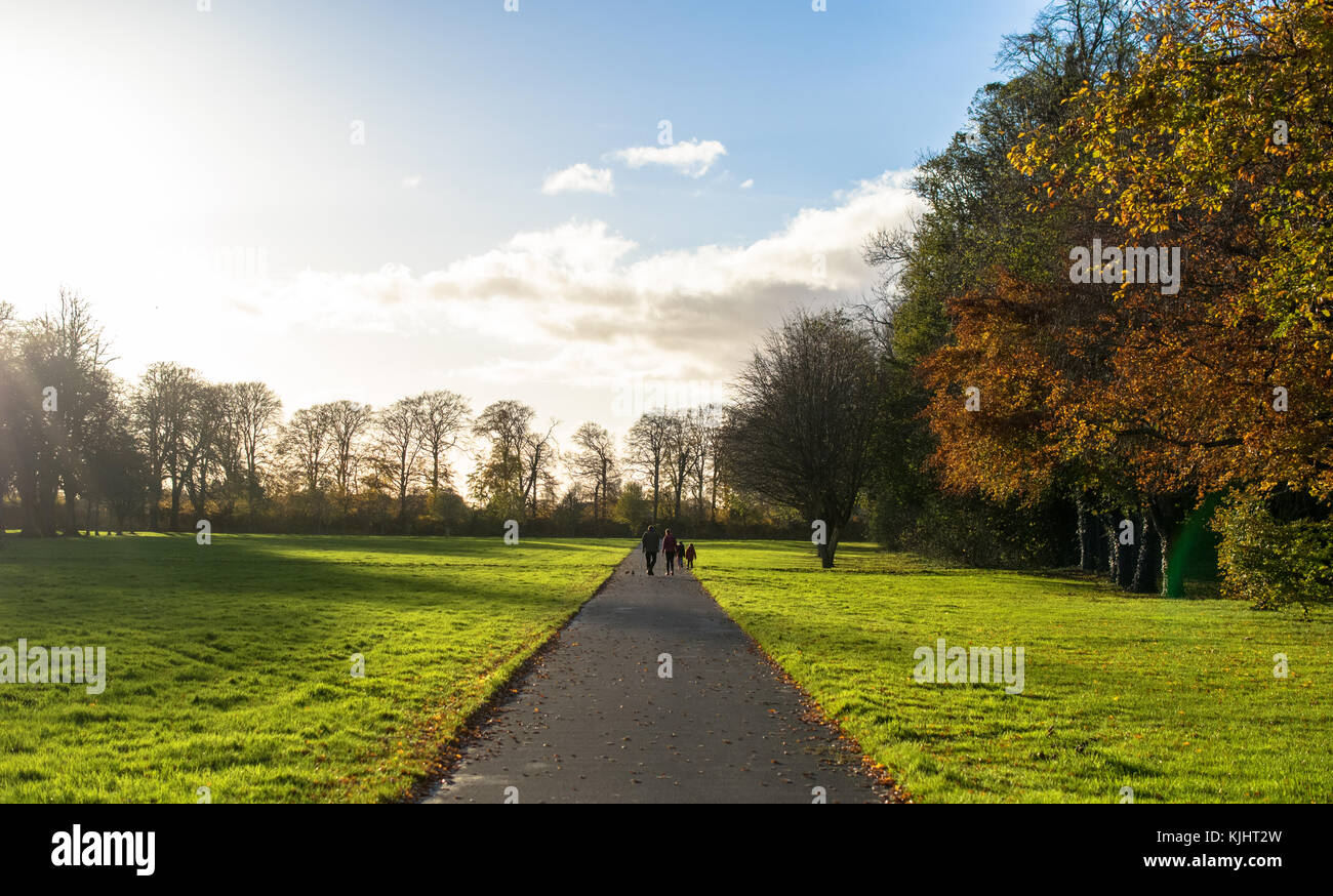 Family walking into the distance Stock Photo - Alamy
