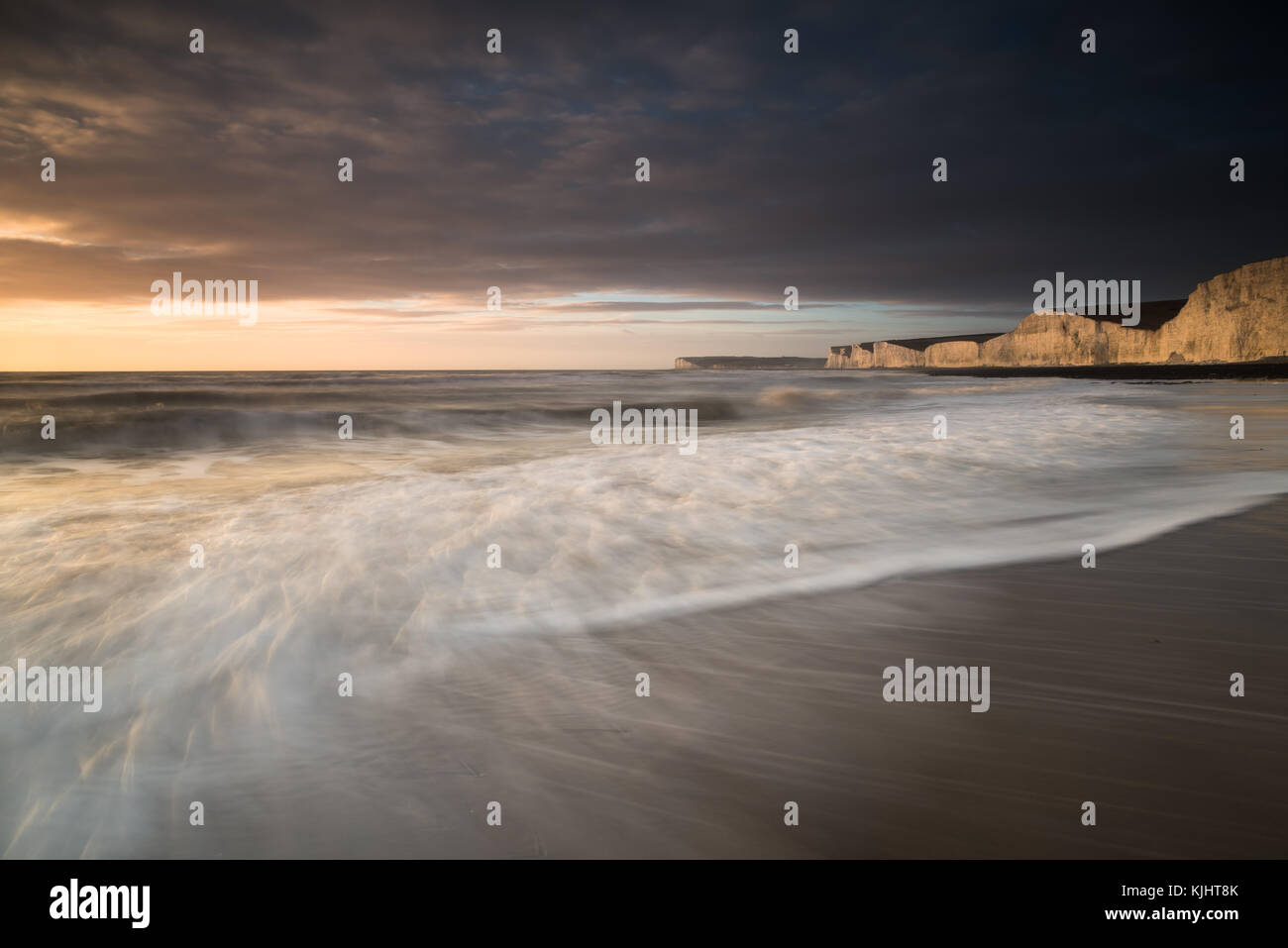 Birling Gap beach and the Seven Sisters white cliffs during sunset ...