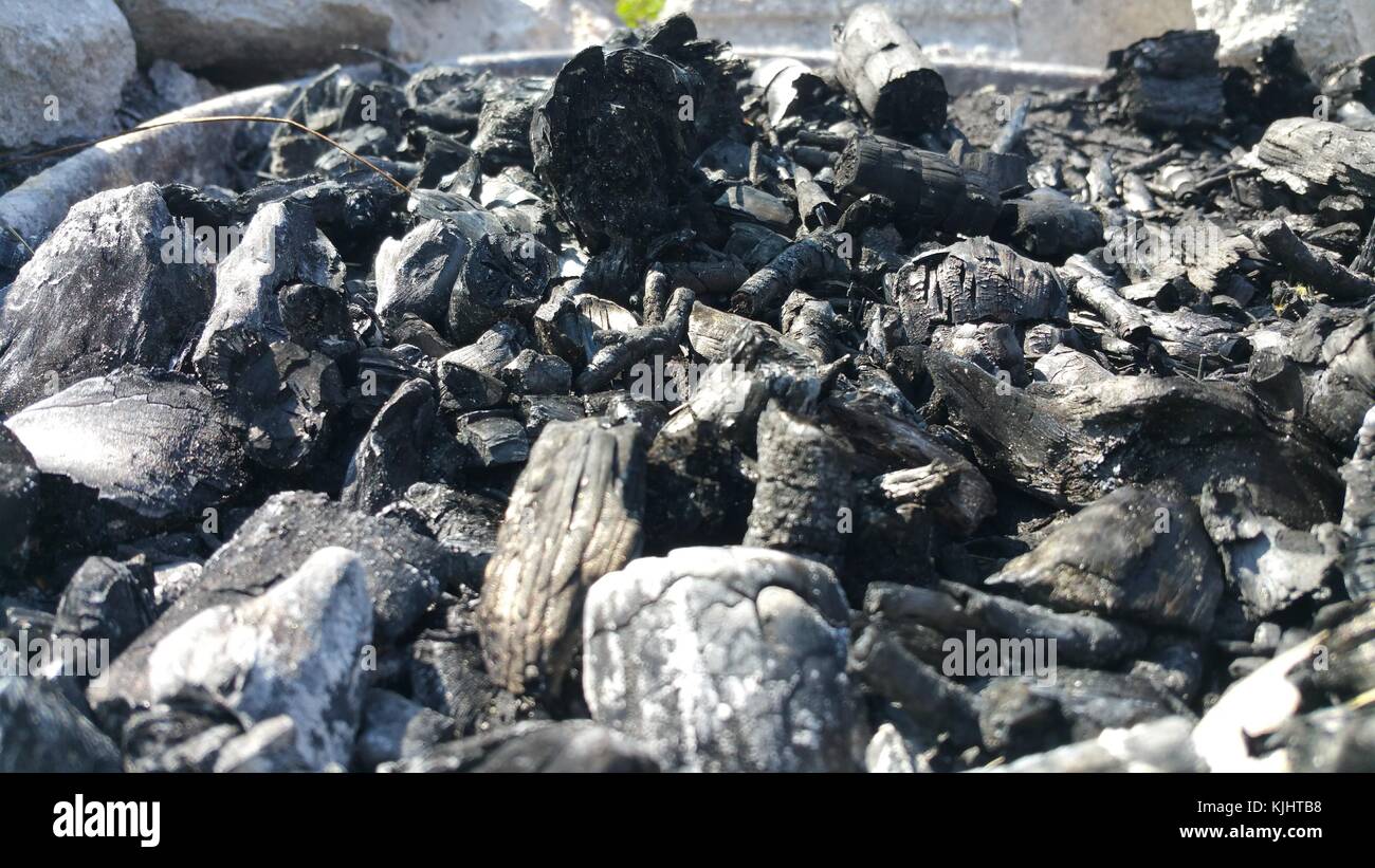 Charcoals in an outdoor fire-pit Stock Photo - Alamy
