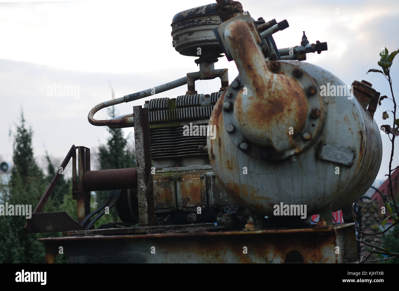 Old rusty industrial engine standing on the street Stock Photo - Alamy