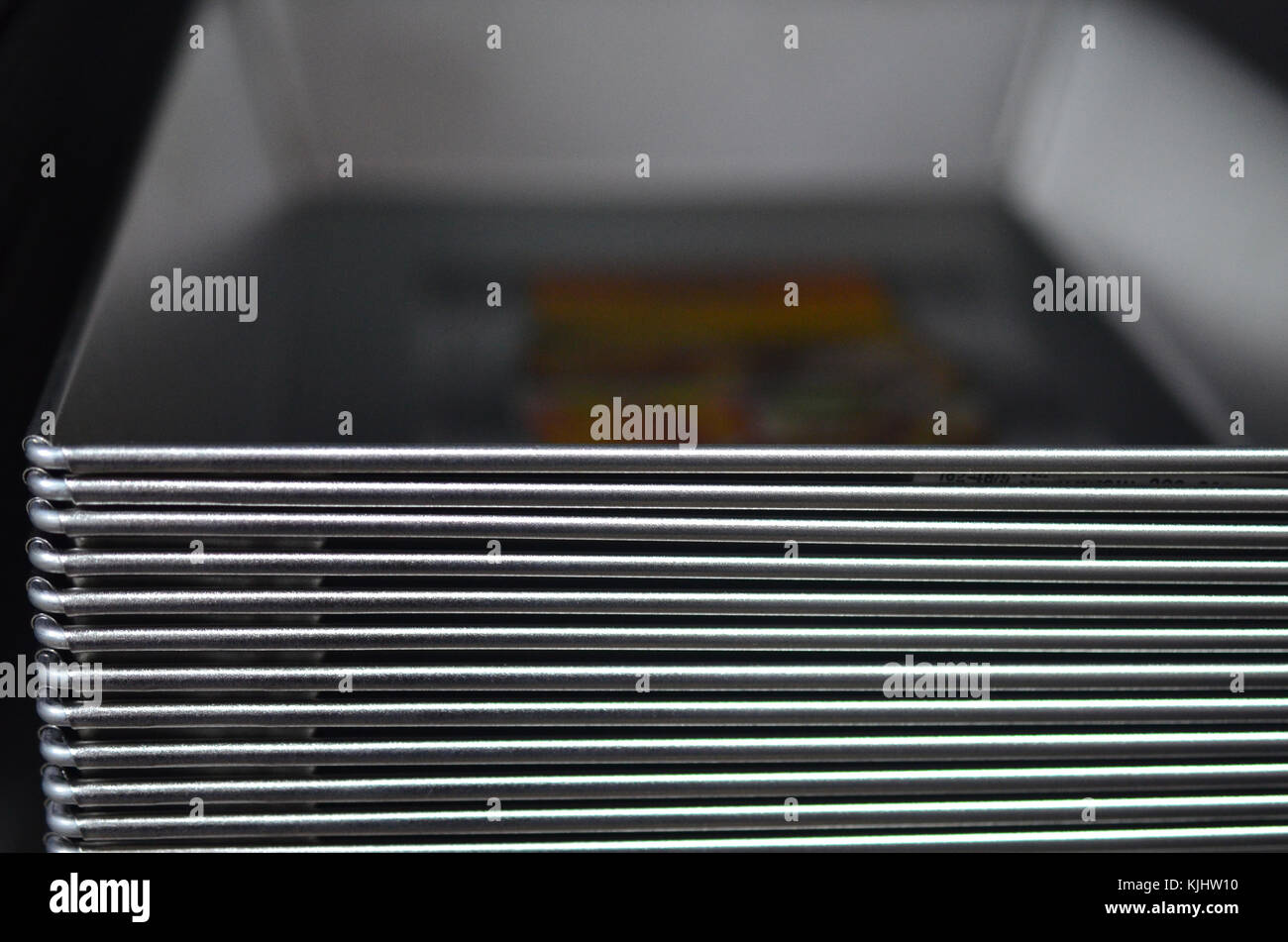 A stack of shiny metal trays for the kitchen Stock Photo - Alamy